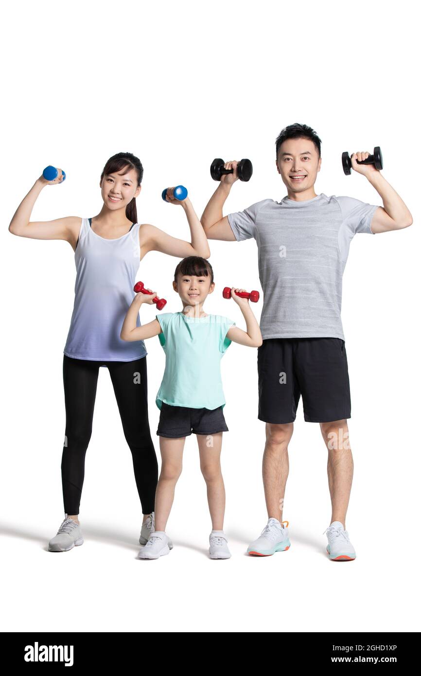 Family Exercising Together In A Gym
