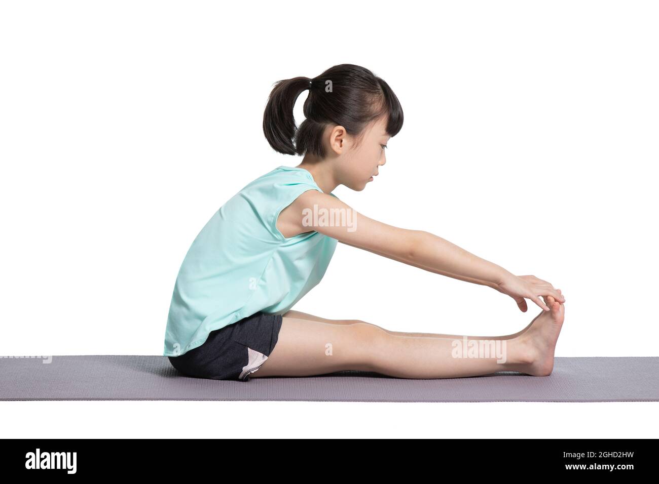 Happy little girl doing exercise Stock Photo - Alamy