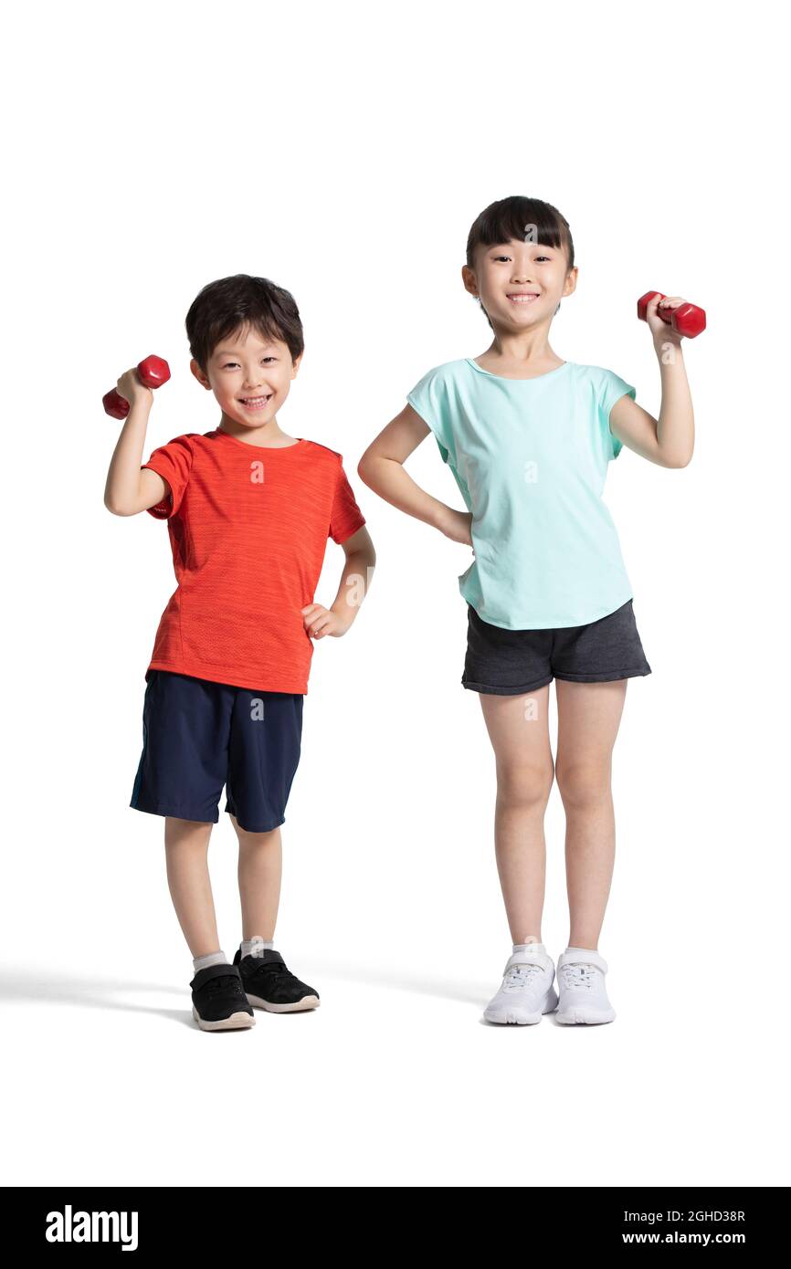 Cute children exercising with dumbbells Stock Photo - Alamy
