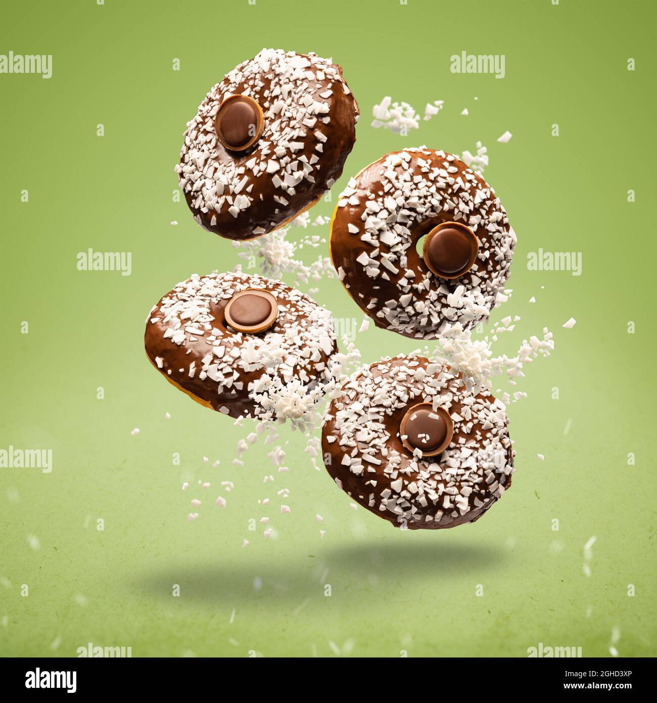 Flying chocolate glazed donuts with coconut chips and chocolate truffle ...