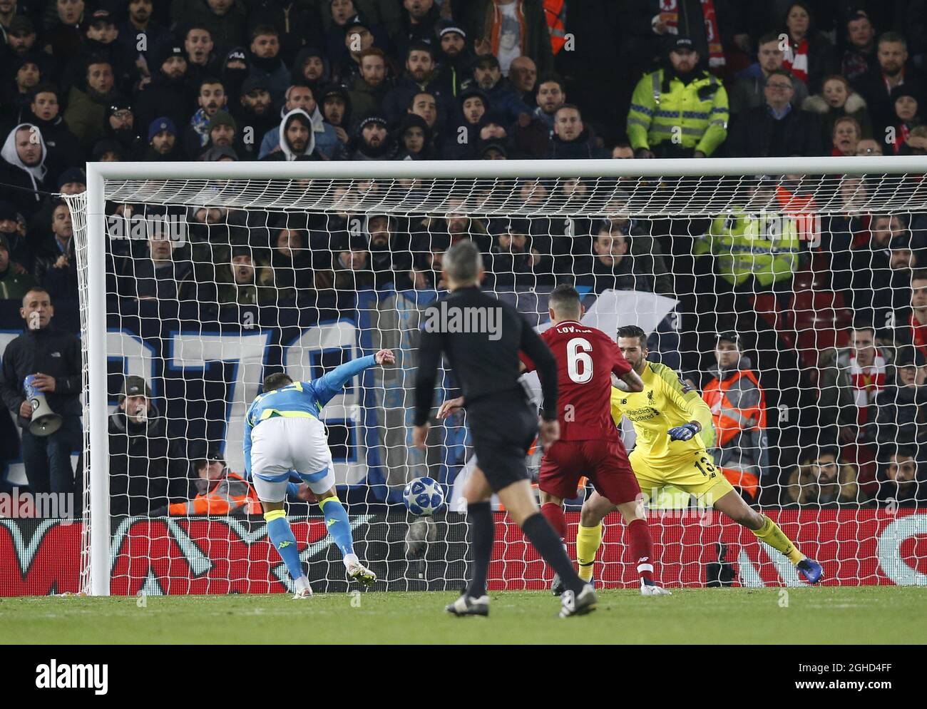 Alisson Becker of Liverpool makes a last minute save from Arkadiusz ...