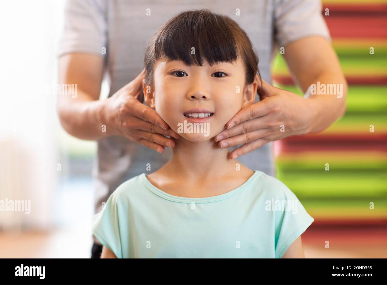 Little girl having exercise class in gym Stock Photo - Alamy