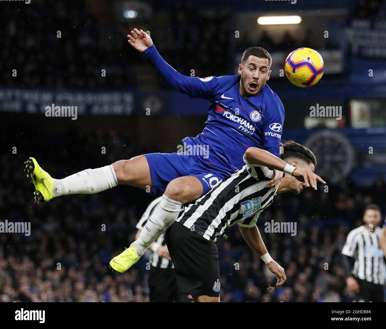 Chelsea's Eden Hazard tussles with Newcastle's Ayoze Perez during the ...