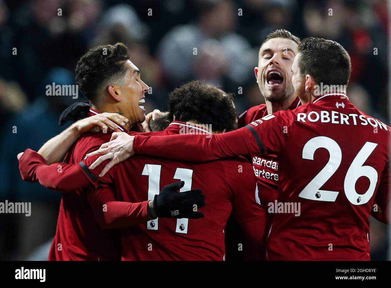 Liverpool players celebrate a goal by Mohamed Salah during the Premier ...