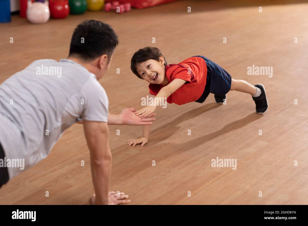 Little boy having exercise class in gym Stock Photo - Alamy