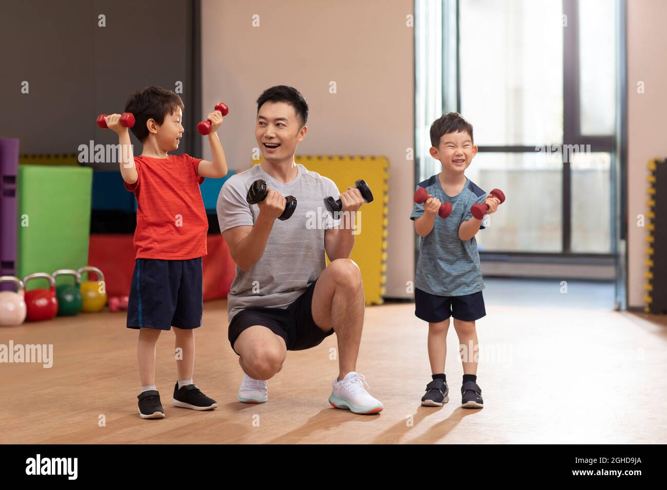 Little boys having exercise class in gym Stock Photo - Alamy