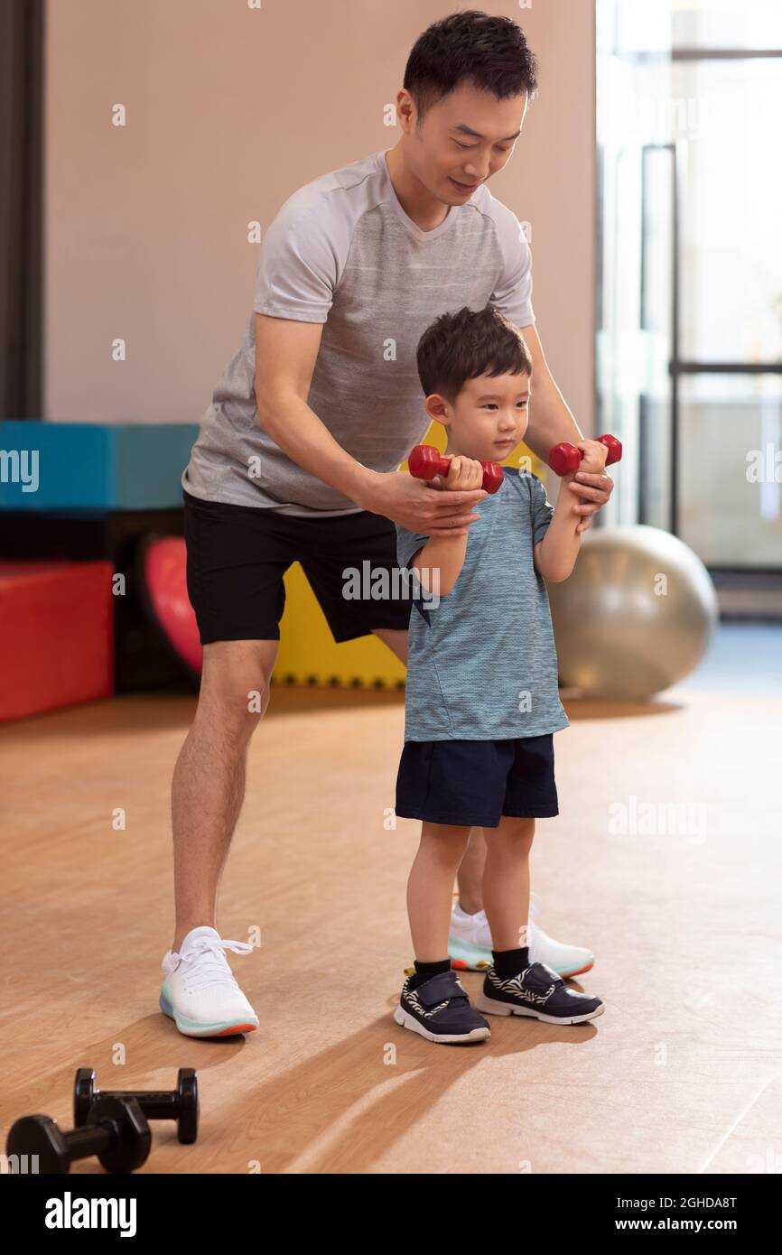 Little boy having exercise class in gym Stock Photo - Alamy