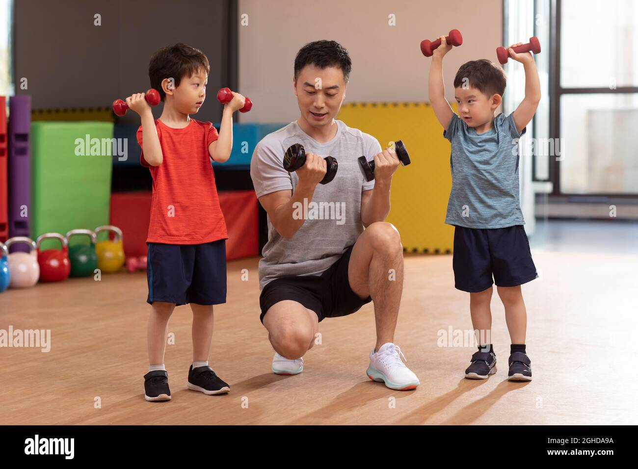 Little boys having exercise class in gym Stock Photo - Alamy