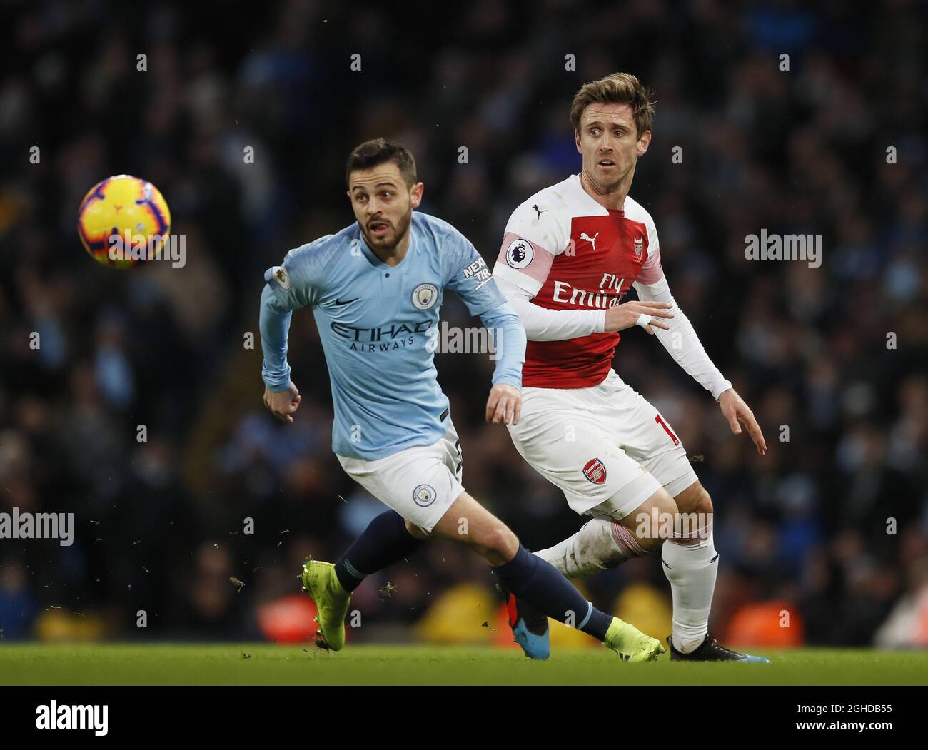 Bernardo Silva of Manchester City tackled by Nacho Monreal of Arsenal ...