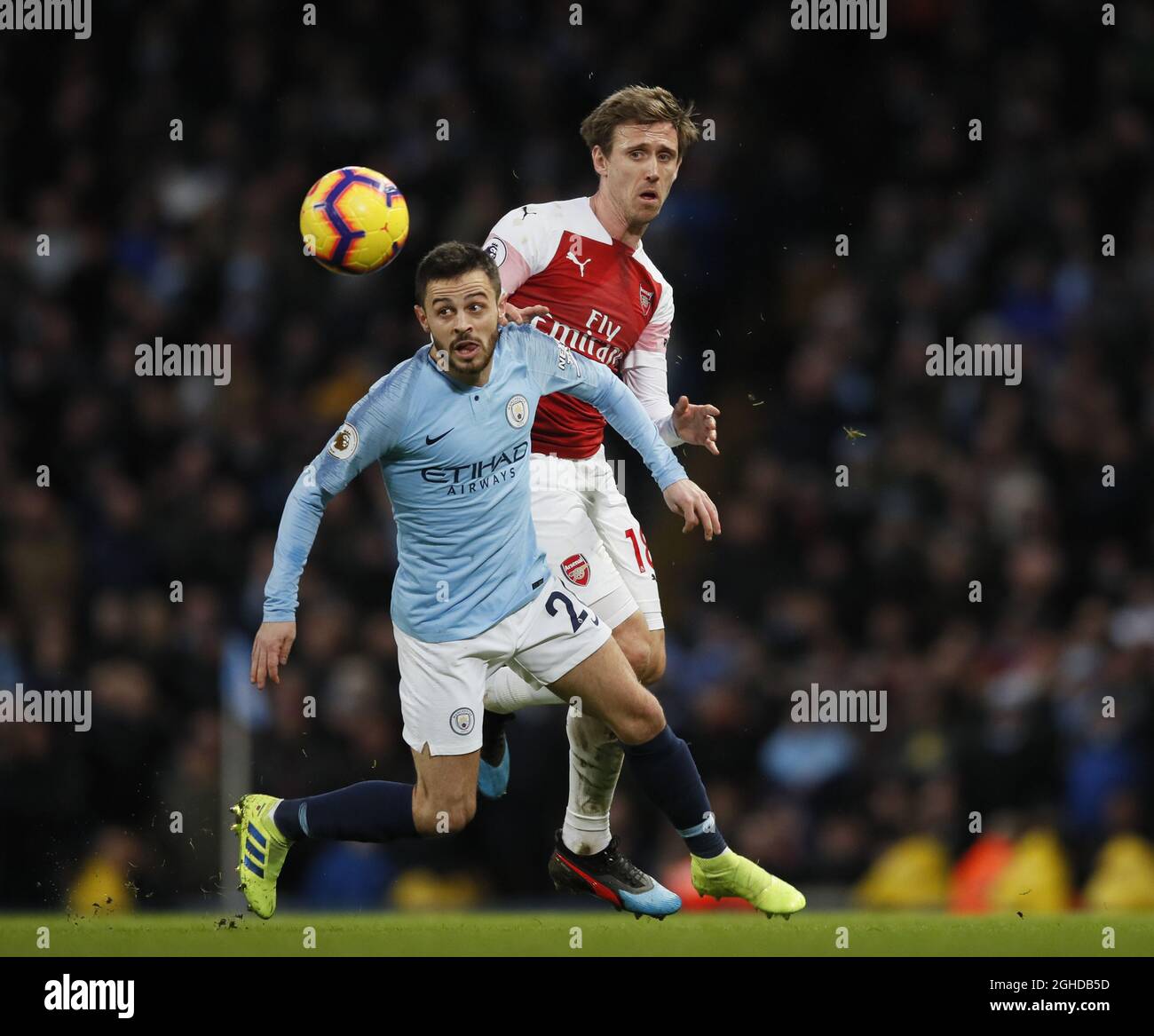 Bernardo Silva of Manchester City tackled by Nacho Monreal of Arsenal ...