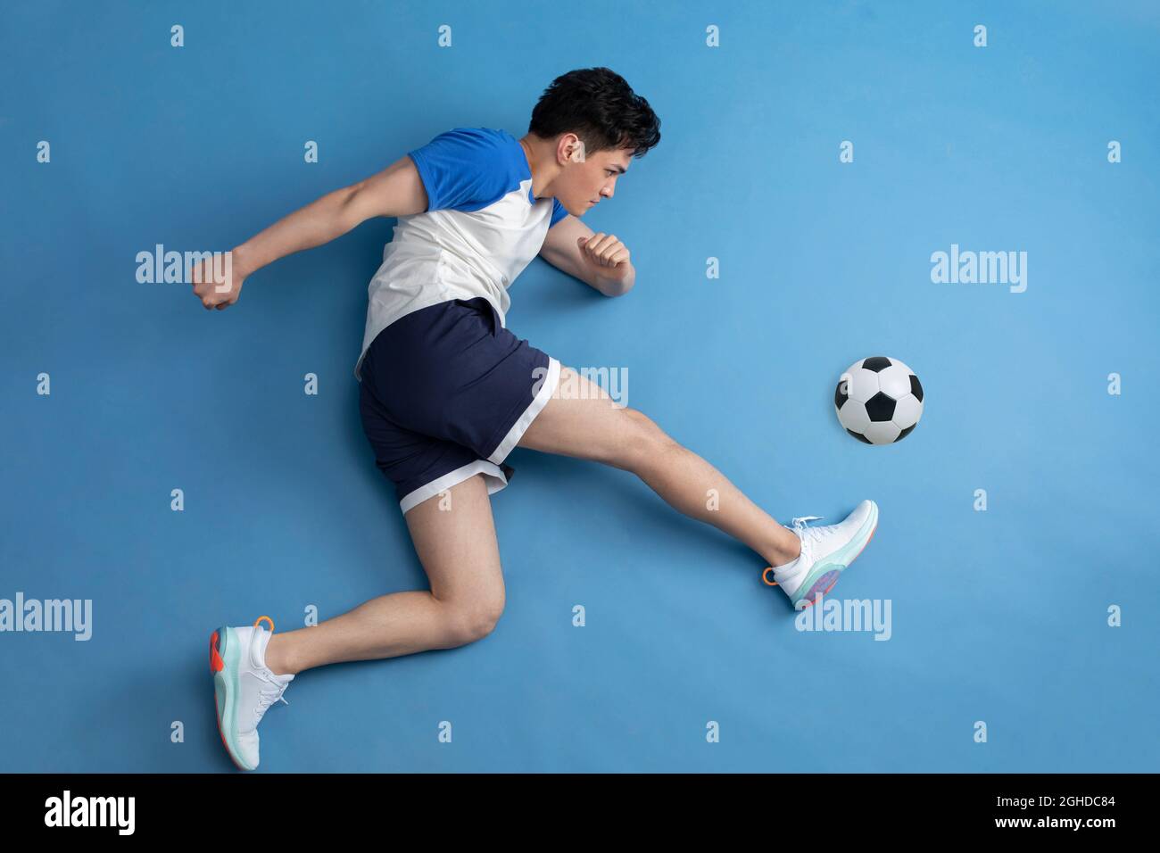 Young man playing soccer hi-res stock photography and images - Alamy