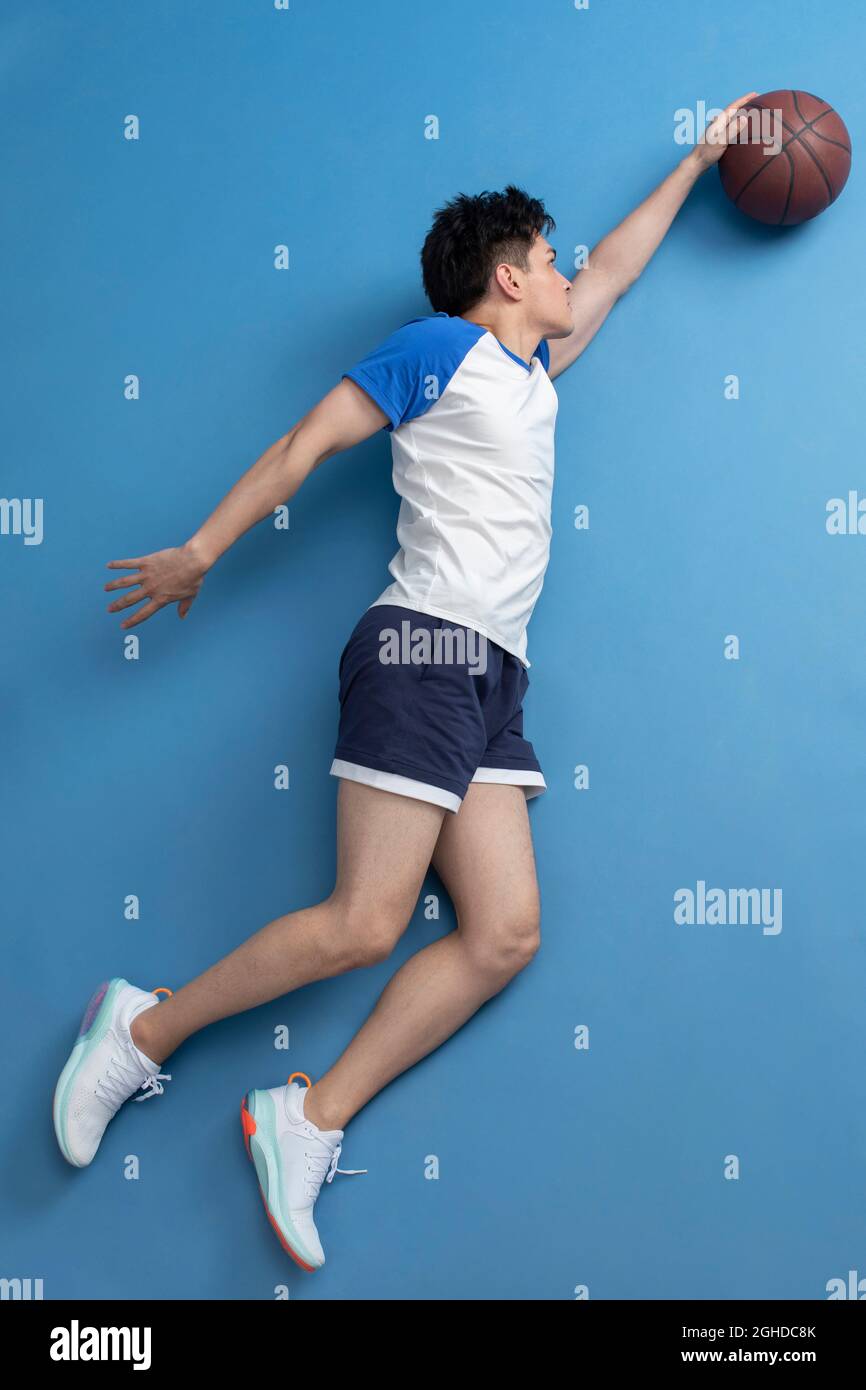 Young man lying on basketball hi-res stock photography and images - Alamy