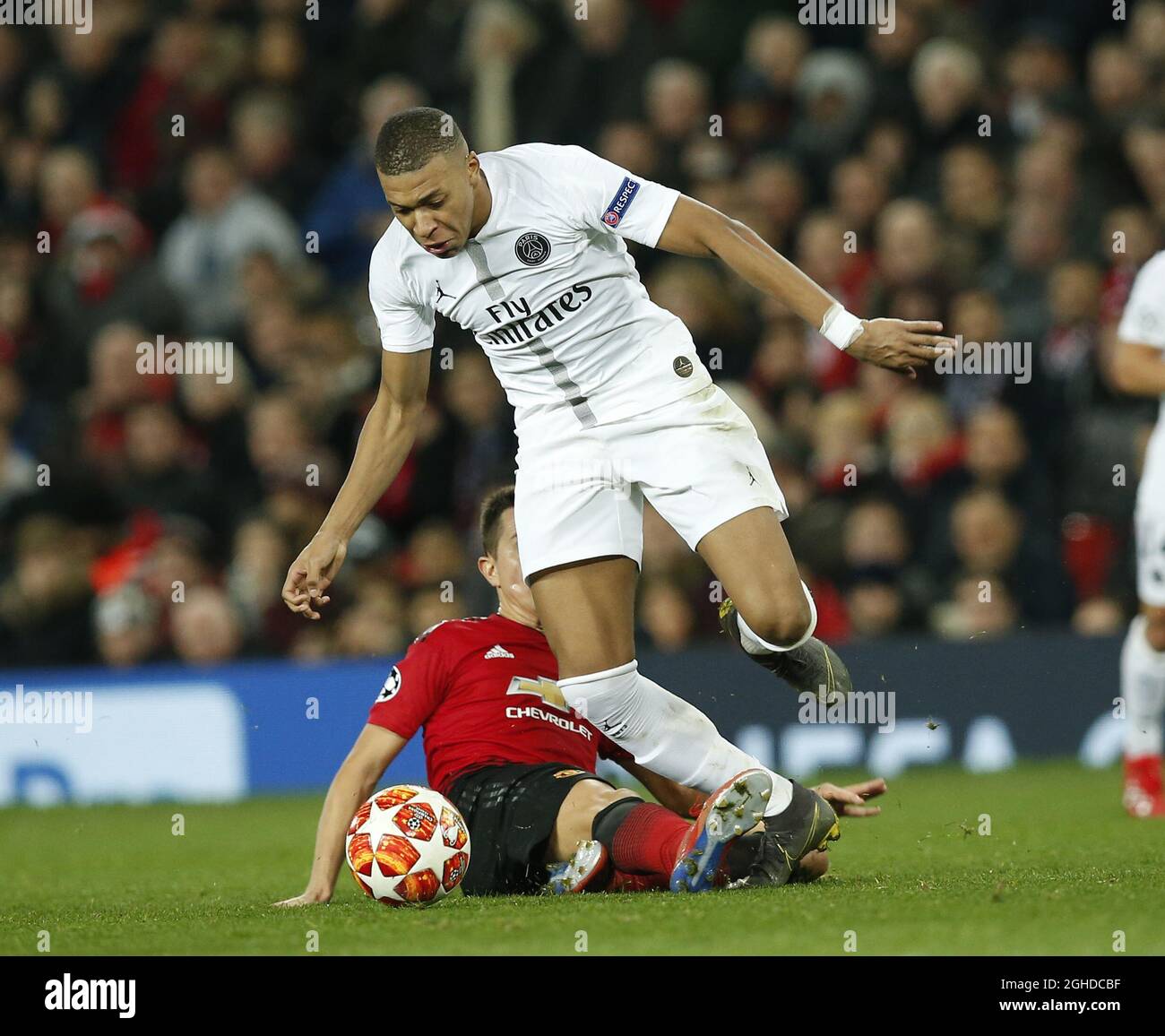 Kylian Mbappe of PSG tackled by Ander Herrera of Manchester United ...