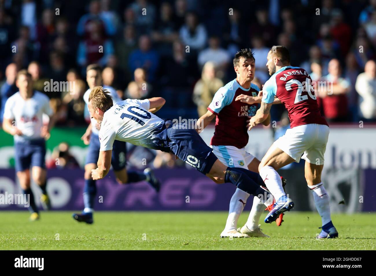 Harry Kane of Tottenham Hotspur goes down after contact with Phillip ...