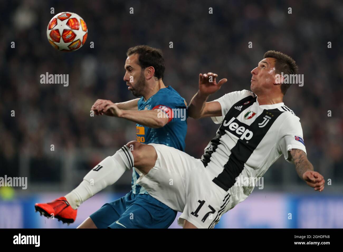 Diego Godin of Atletico Madrid and Mario Mandzukic of Juventus during ...