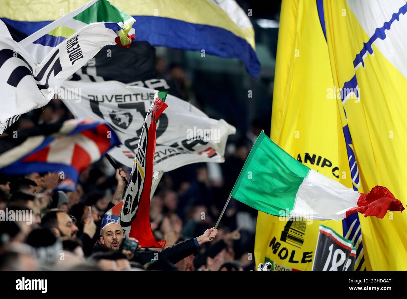 Juventus fans wave flags during the UEFA Champions League Round of 16 ...