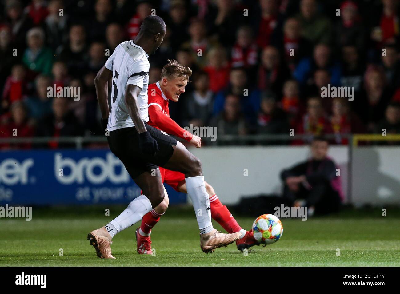 George Thomas (r) of Wales shoots during the International Friendly ...