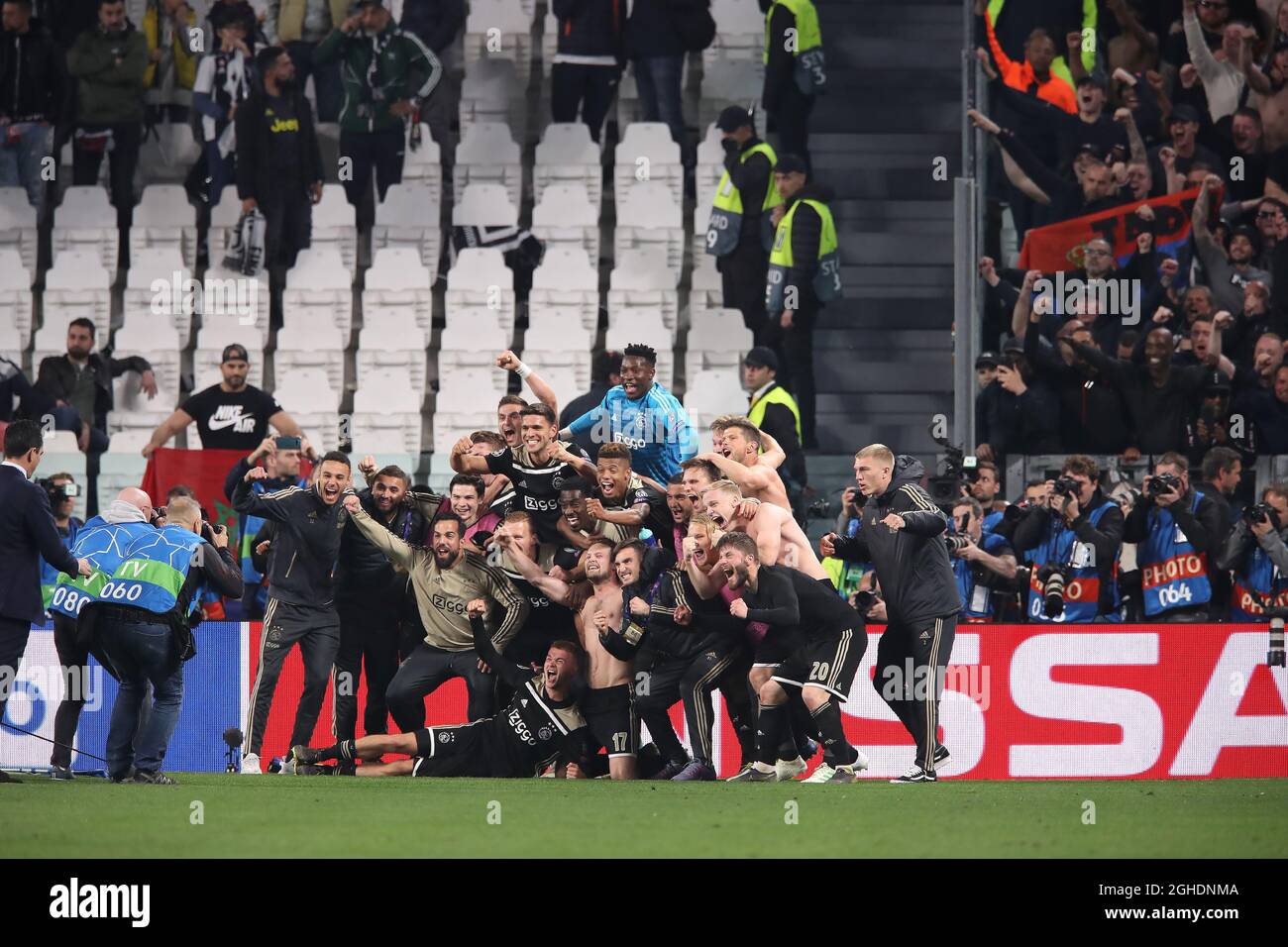 The Ajax team poses for a photo in front of their fans after the final ...
