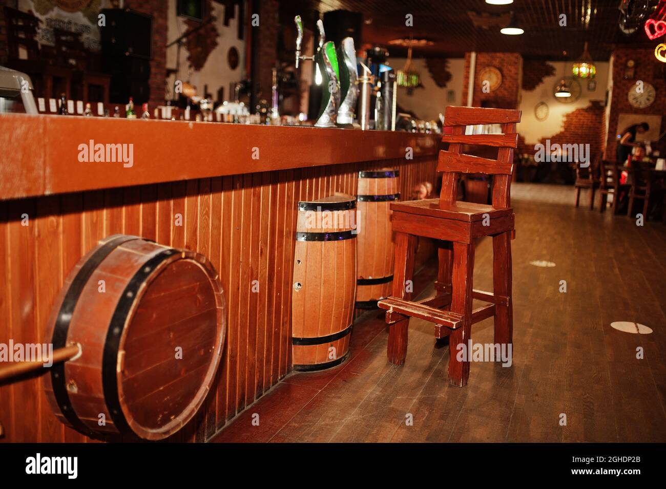 Wooden barrel and chair in pub bar counter Stock Photo - Alamy