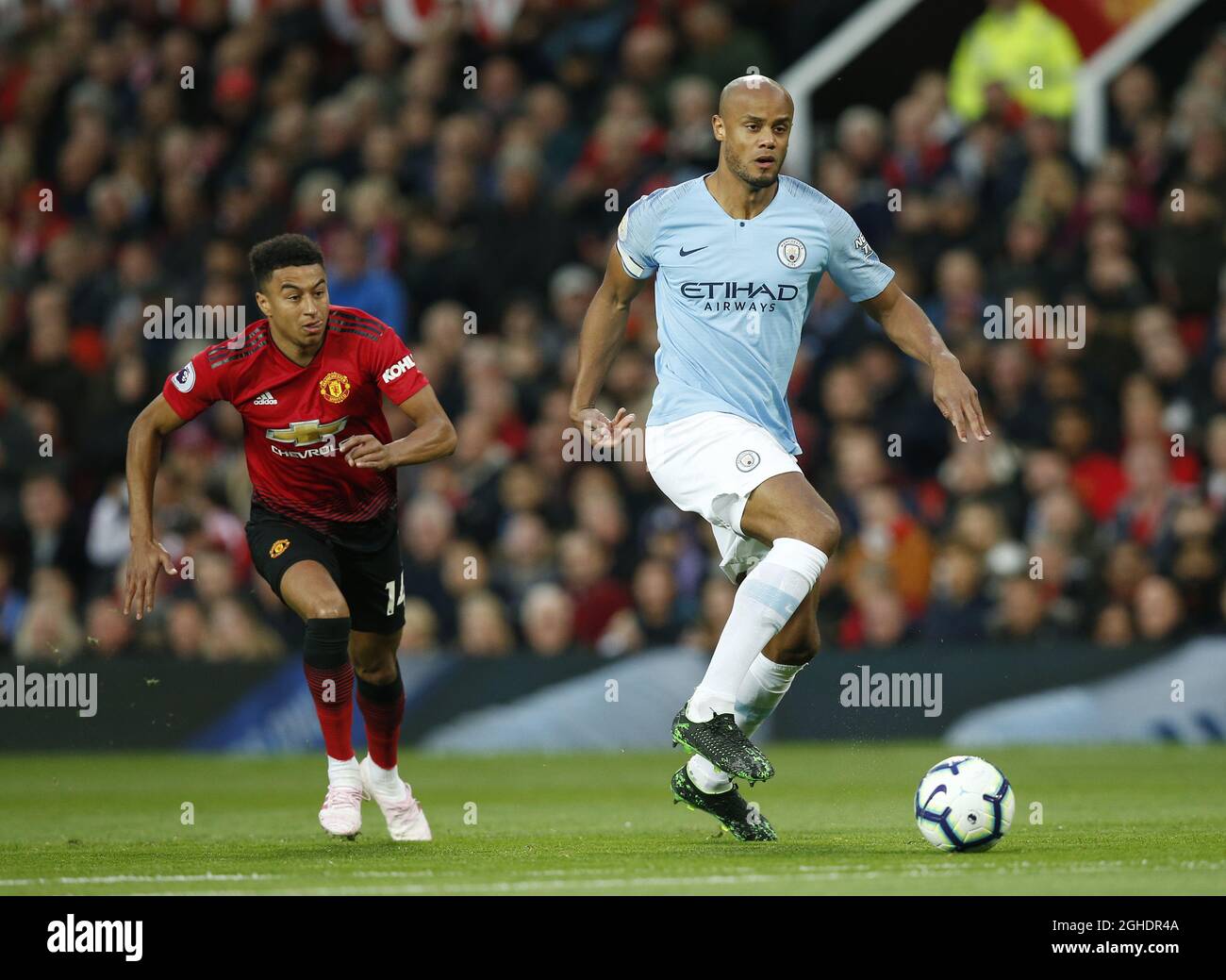 Vincent Kompany of Manchester City evades Jesse Lingard of Manchester ...