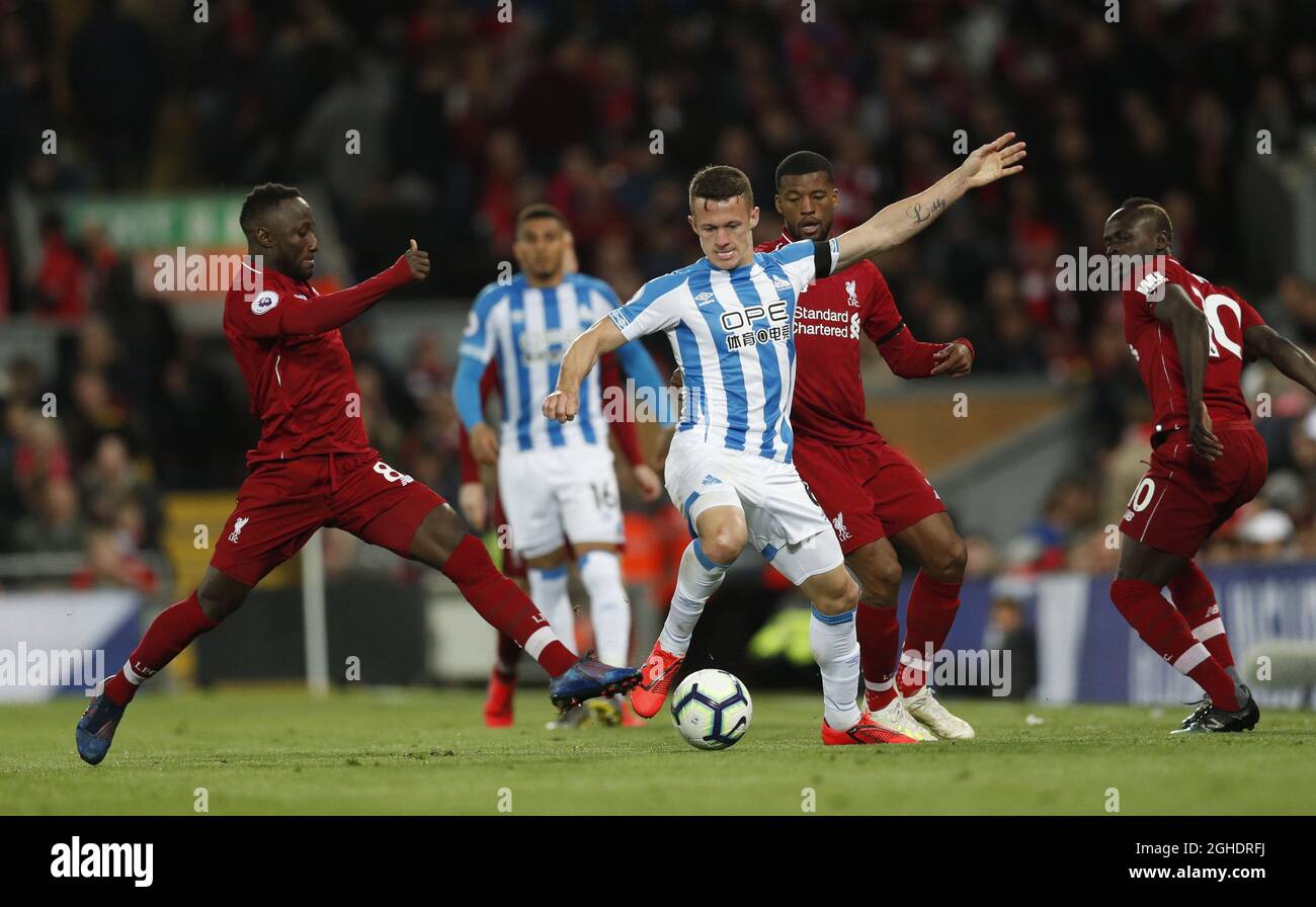 Jonathan Hogg of Huddersfield Town tackled by Naby Keita of Liverpool ...