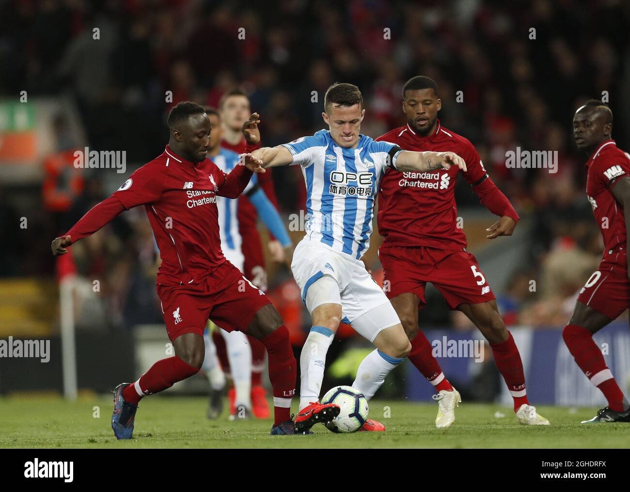 Jonathan Hogg of Huddersfield Town tackled by Naby Keita of Liverpool ...