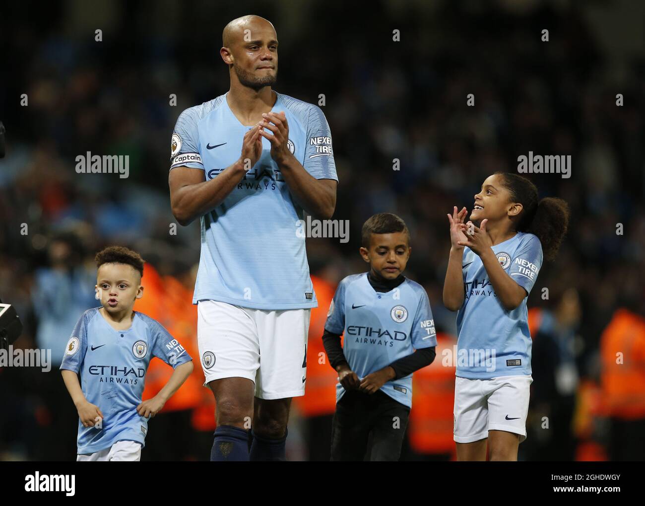 Vincent Kompany of Manchester City walks round the pitch with his ...
