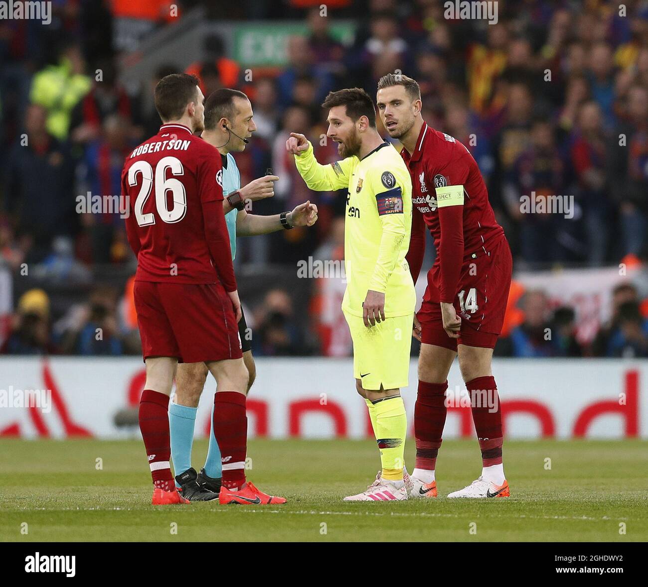 Liverpool's Andy Robertson argues with Barcelona's Lionel Messi during ...