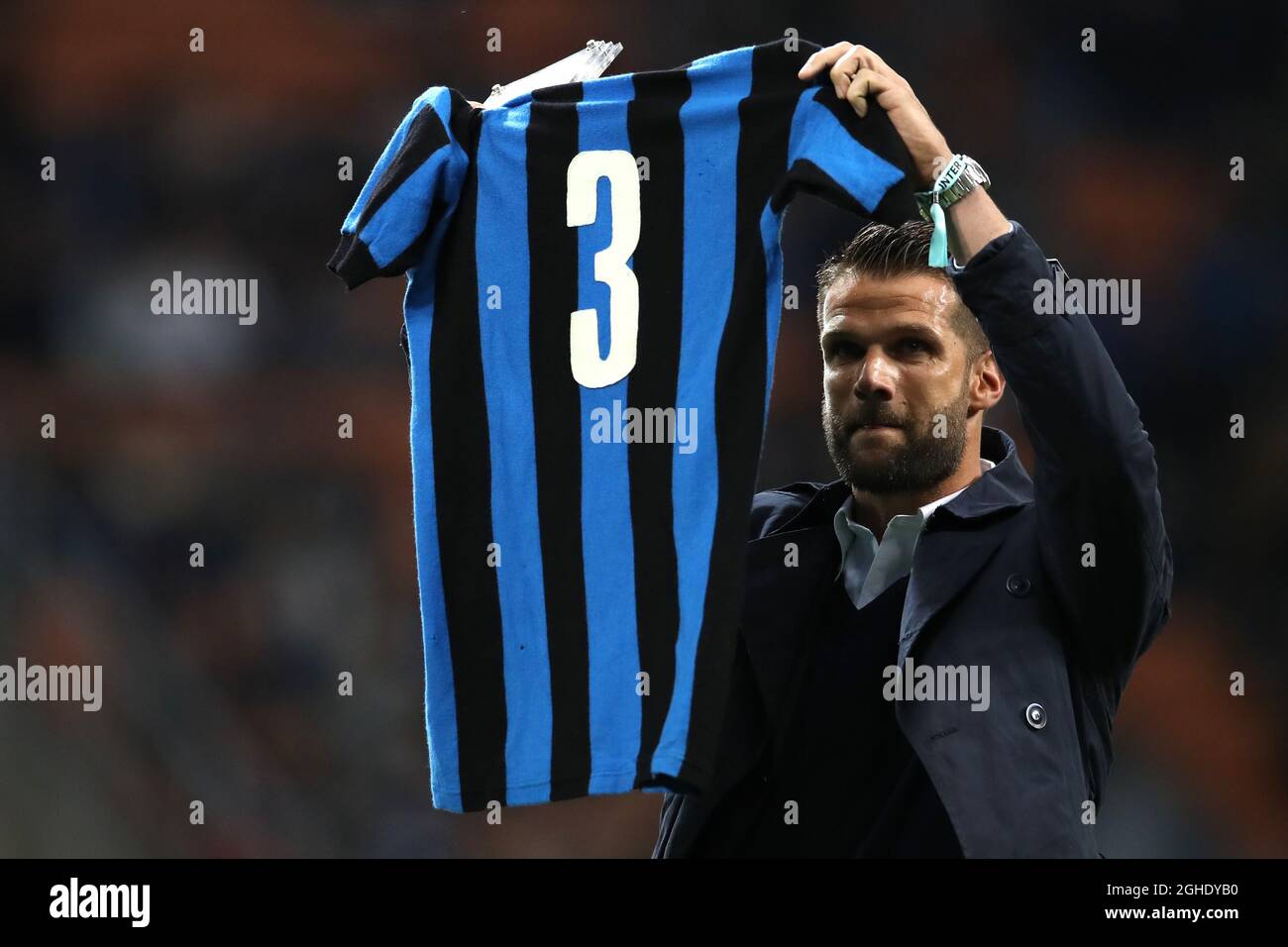 Luca Facchetti on behalf of Giacinto Facchetti holds up a number 3 ...