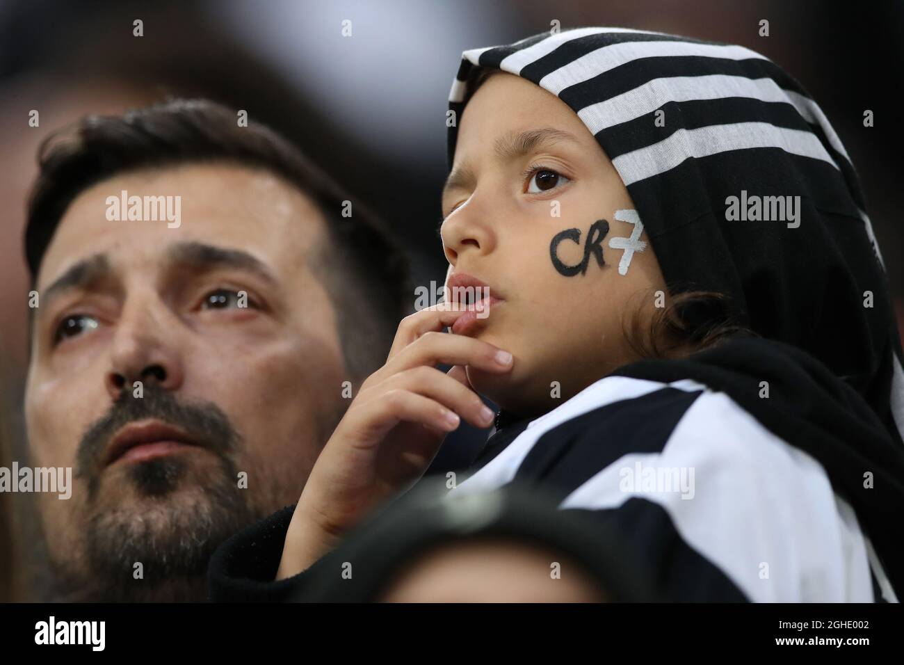 A young child with CR/ painted on his face pictured during the Serie A ...