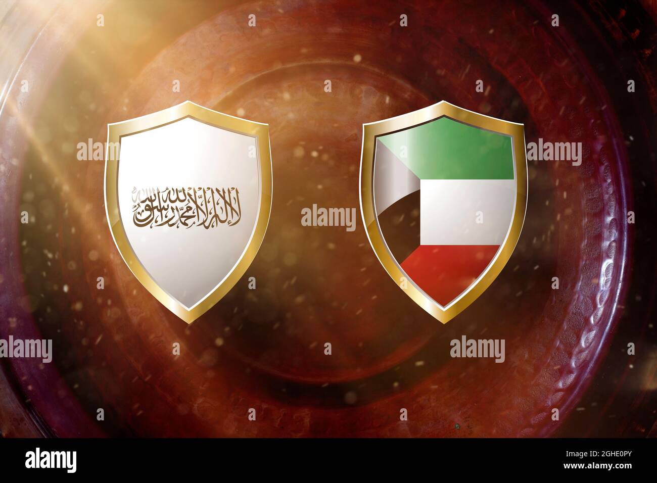 taliban and kuwait flag in golden shield on copper texture background ...