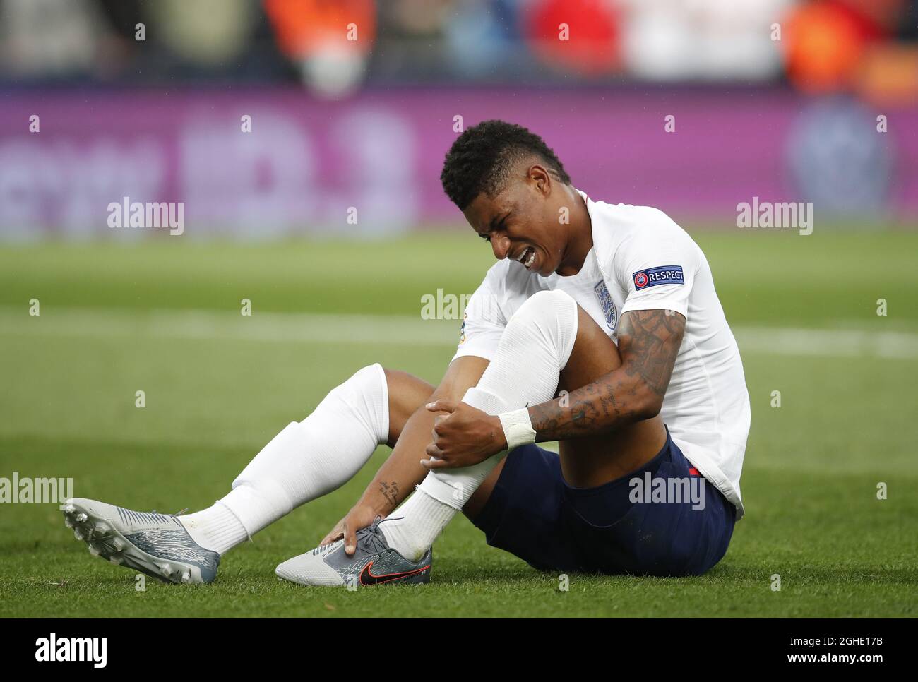 Marcus Rashford of England holds his foot before going off injured ...