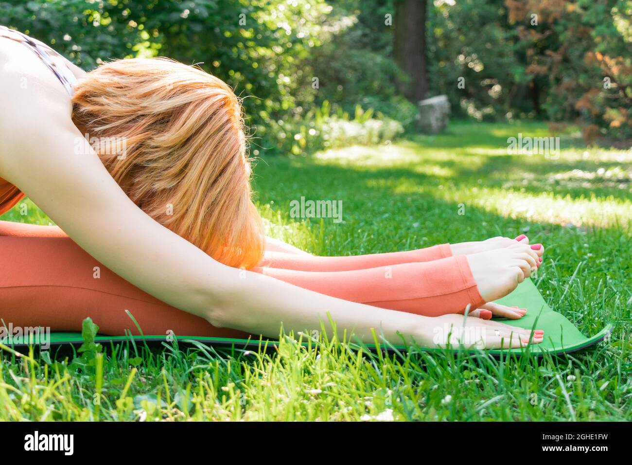 Seated forward fold yoga hi-res stock photography and images - Alamy