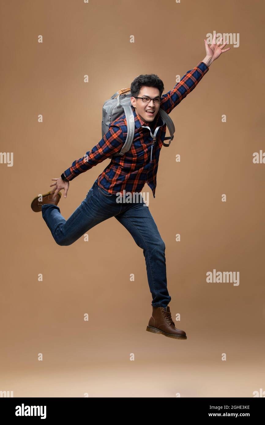 Back view young man jumping air hi-res stock photography and images - Alamy