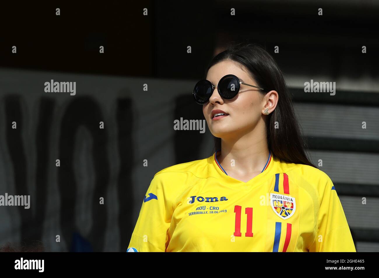A female Romania fan pictured wearing the shirt of Adrian Petre during ...