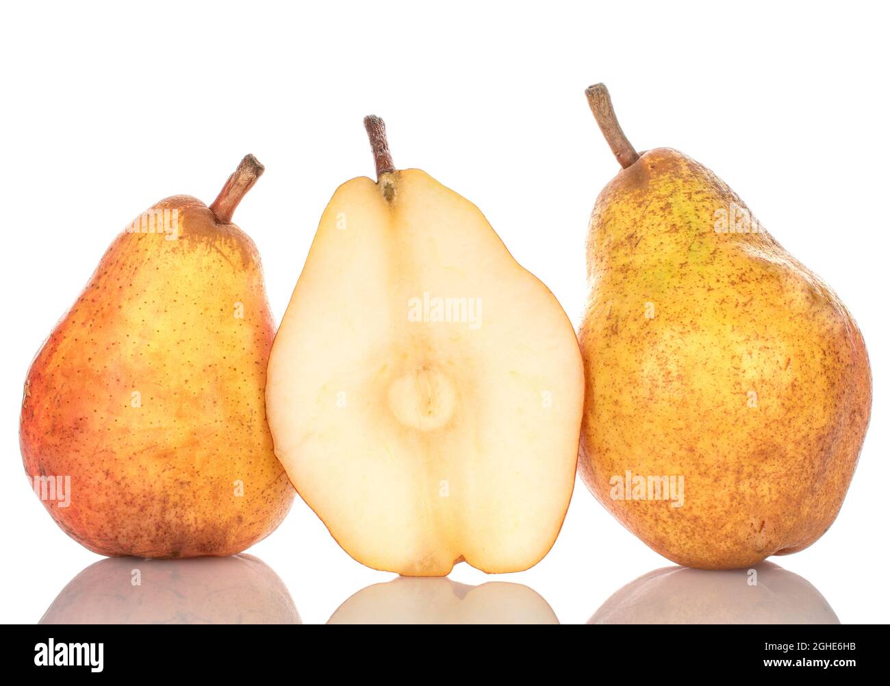 Two whole and half sweet red pears, close-up, on a white background ...