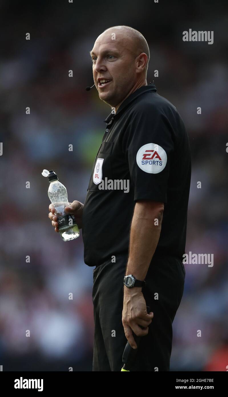 Assistant referee takes a drinks break during the Pre Season Friendly ...