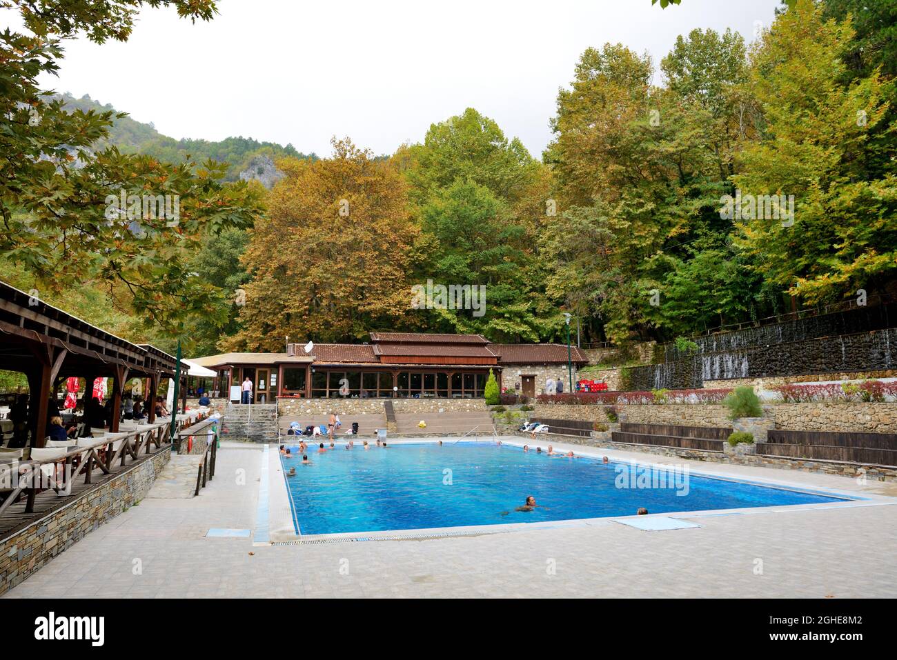 LOUTRA, ARIDEA, GREECE-OCTOBER 13: The tourists swimming in water from ...