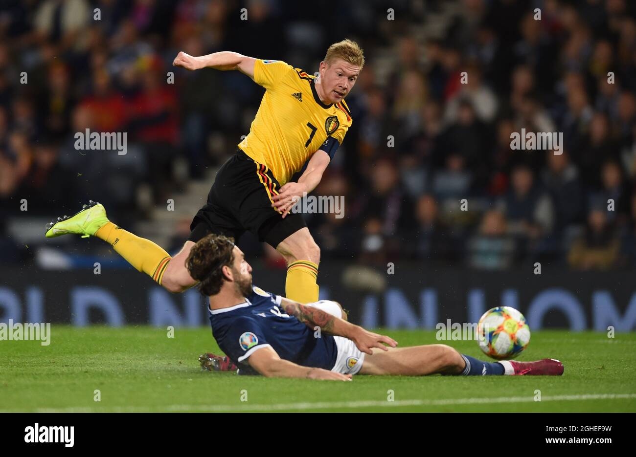 Kevin De Bruyne of Belguim and Charlie Mulgrew of Scotland during the ...