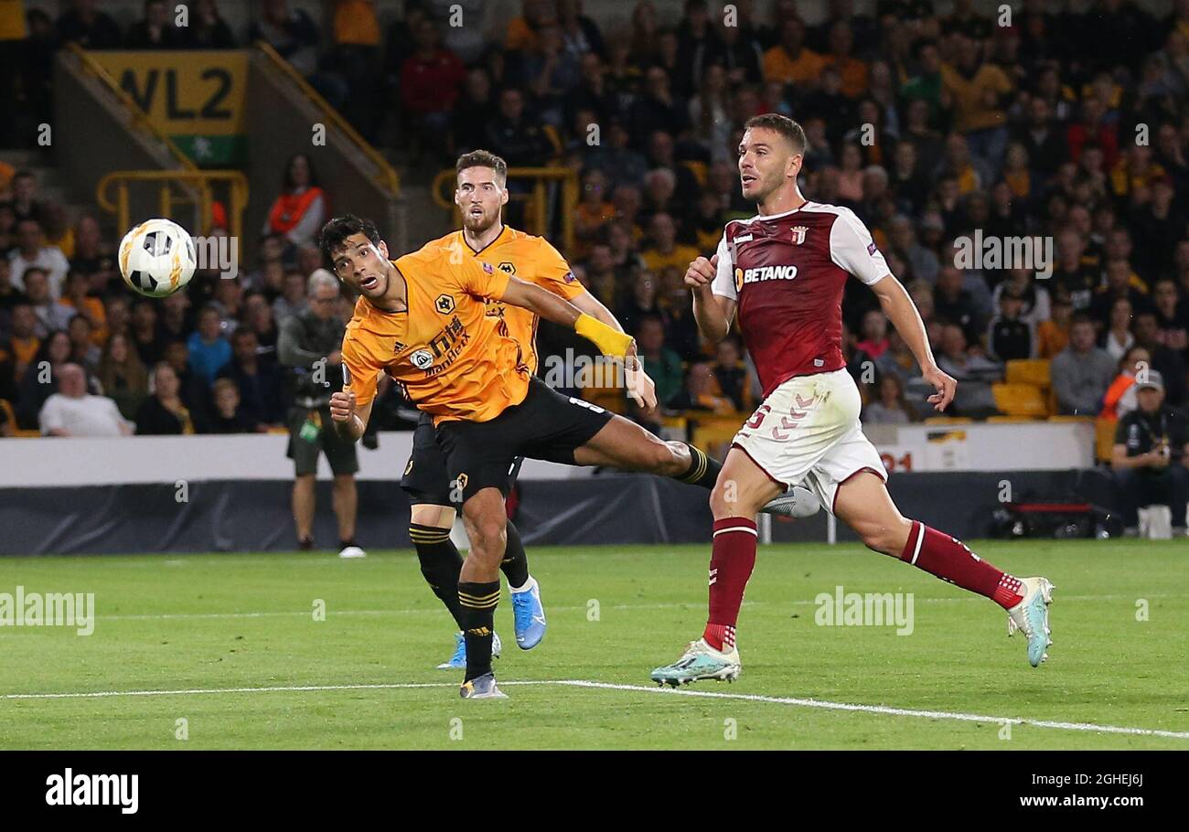 Raul Jimenez of Wolverhampton Wanderers heads into the keepers arms ...