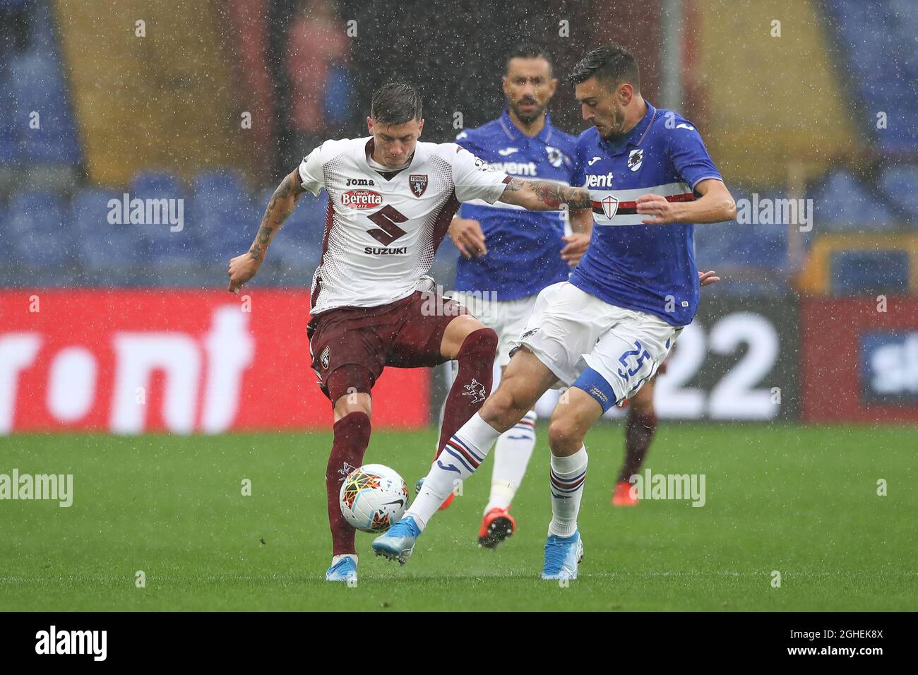 Alex Ferrari of Sampdoria challenges Daniele Baselli of Torino FC ...