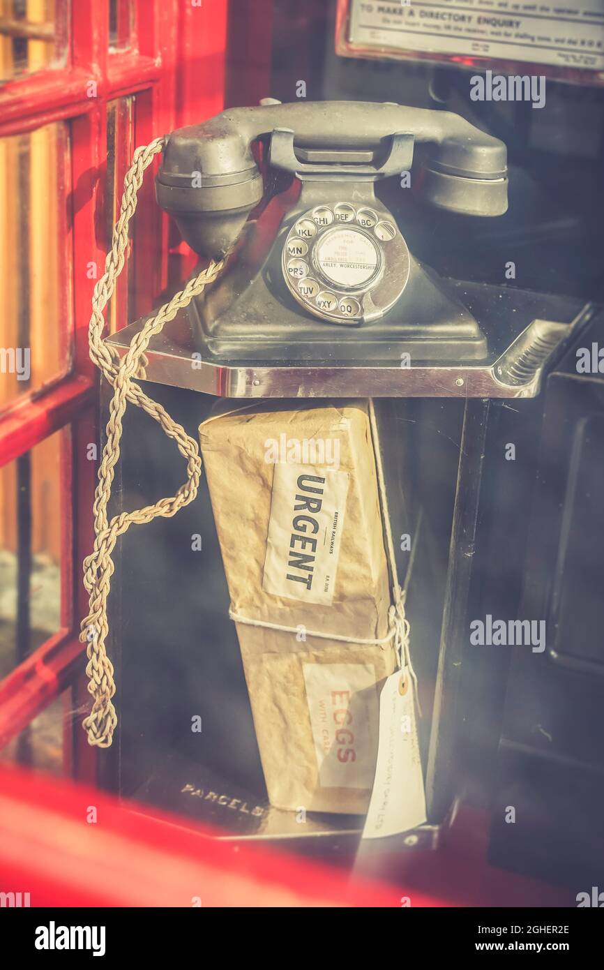 View through the glass of an old, traditional, British red telephone ...