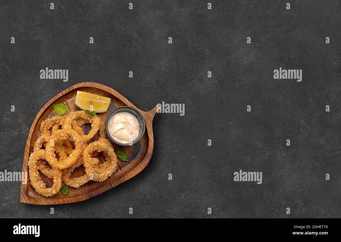 Squid rings in batter with sauce Stock Photo - Alamy