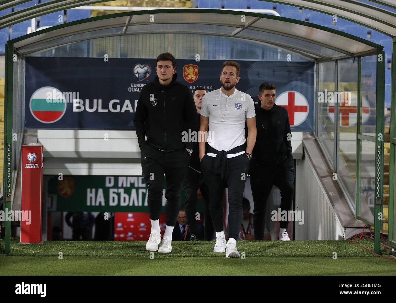 Harry Maguire and Harry Kane walk out to view the stadium before the ...