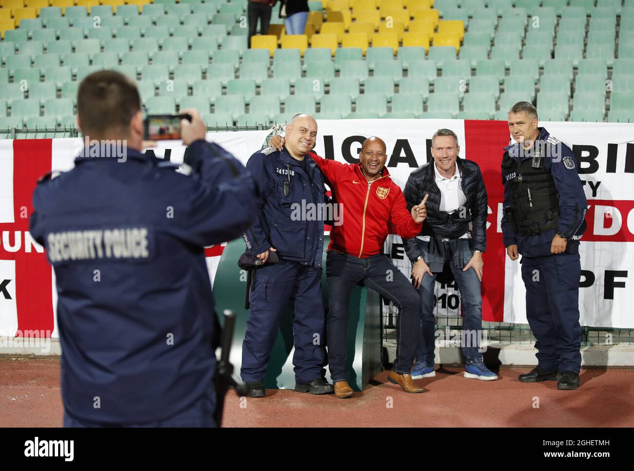 England fans pose with local police for photographs during the UEFA ...