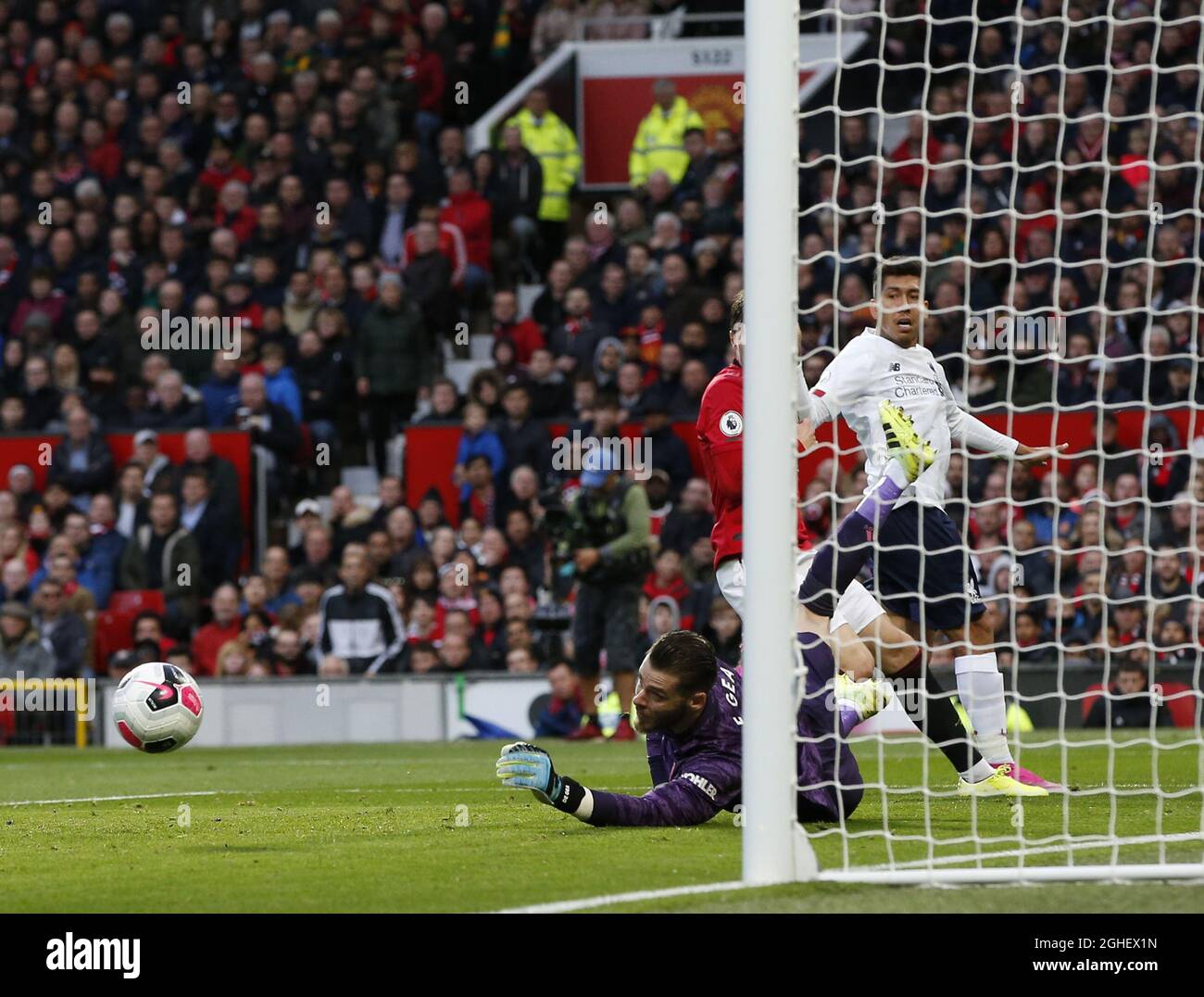 David De Gea of Manchester United saves from Roberto Firmino of ...