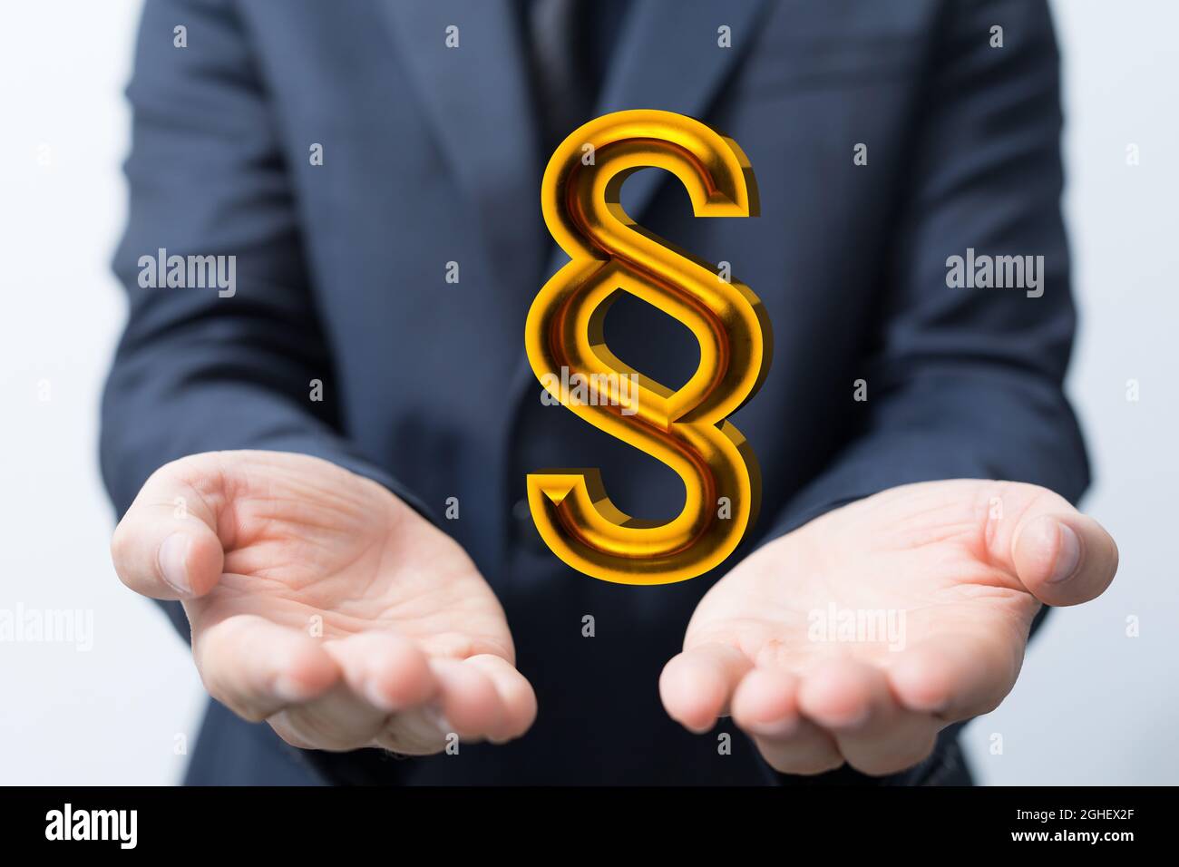 Illustration of a paragraph law sign in hands Stock Photo - Alamy