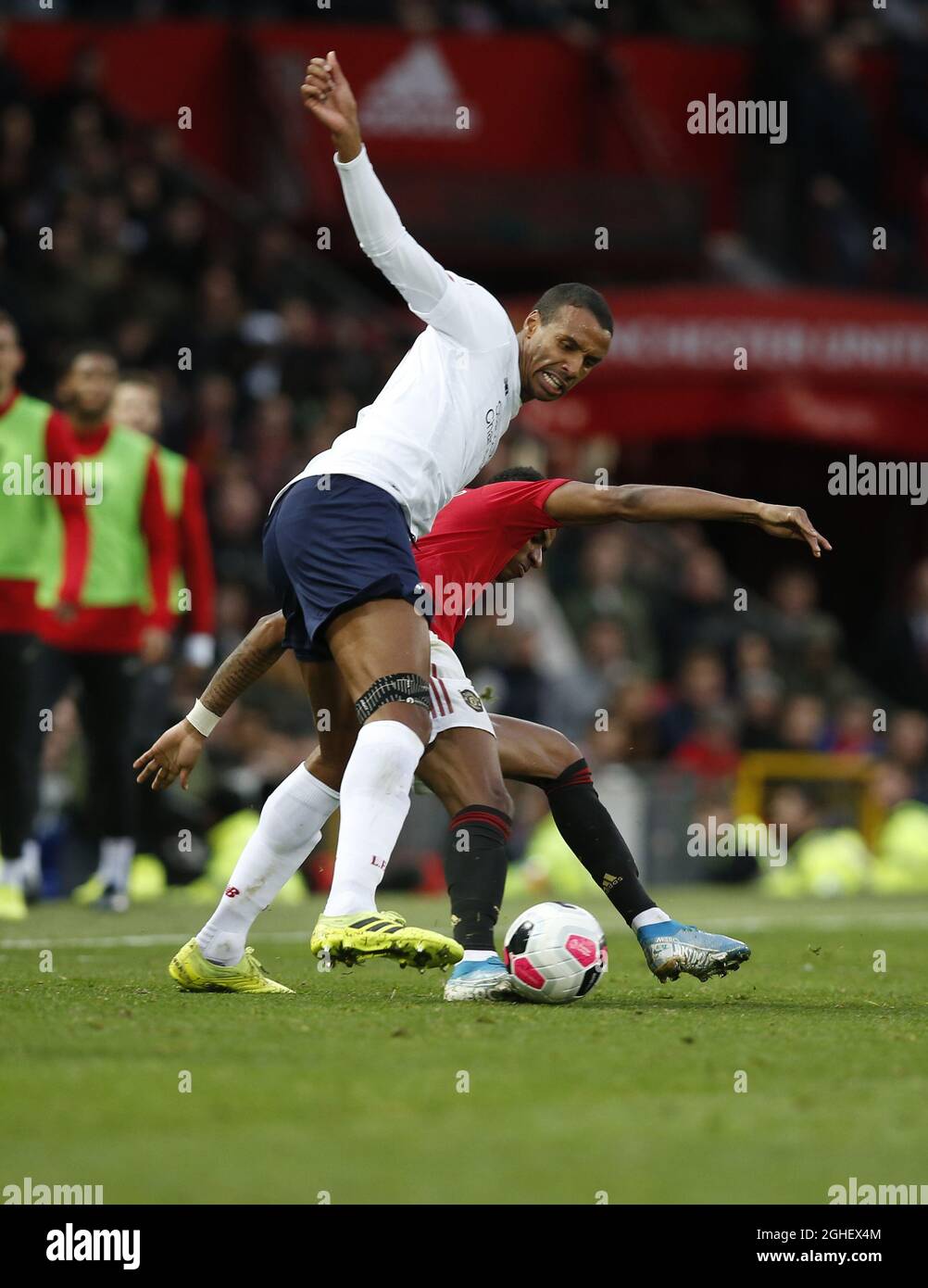 Joel Matip of Liverpool challenges Marcus Rashford of Manchester United ...