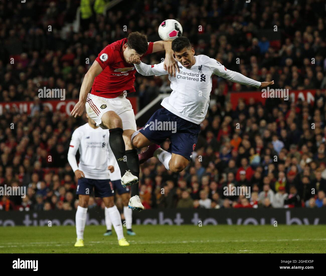 Harry Maguire of Manchester United challenges Roberto Firmino of ...