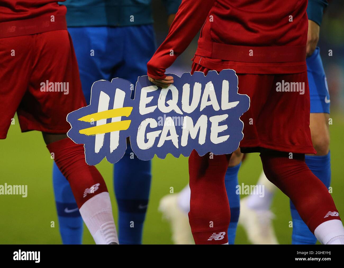 LiverpoolÕs Mohamed Salah hold a sign saying "#Equal Game" during the UEFA Champions League ...
